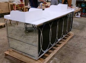 An example of a Laser Cut Mirrored Acrylic Display Counter